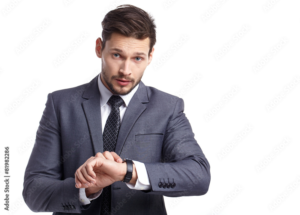 young business man looking at watch over white background Stock-Foto ...