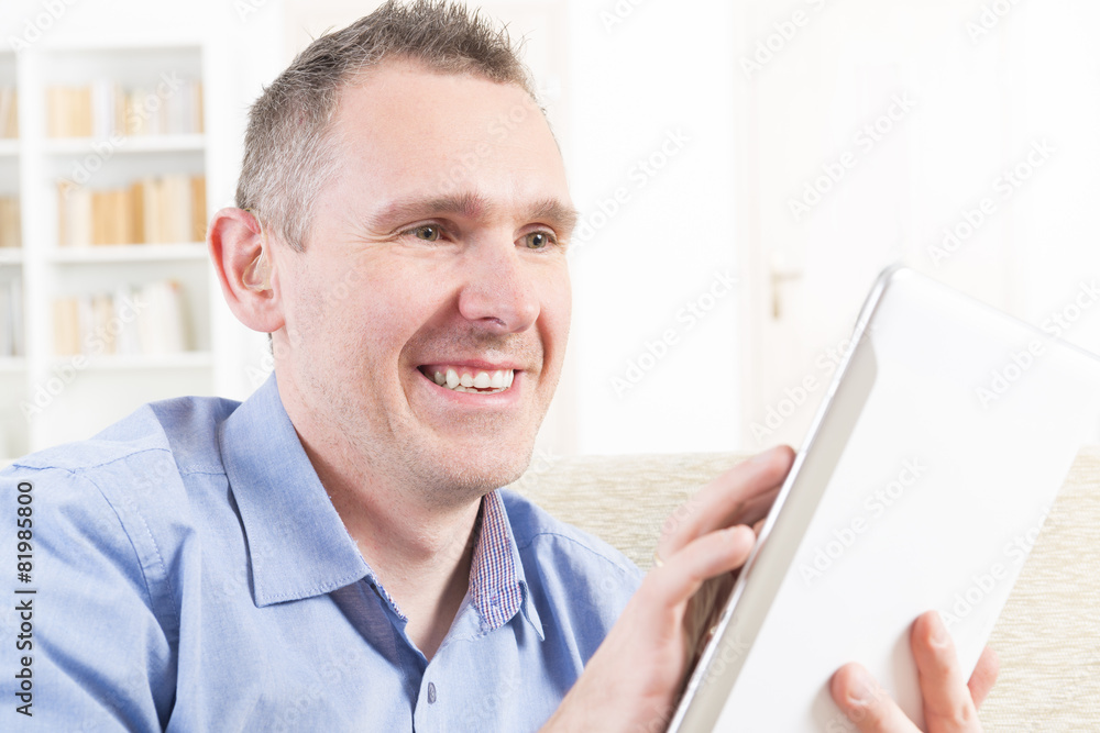 Deaf man using tablet Stock Photo | Adobe Stock