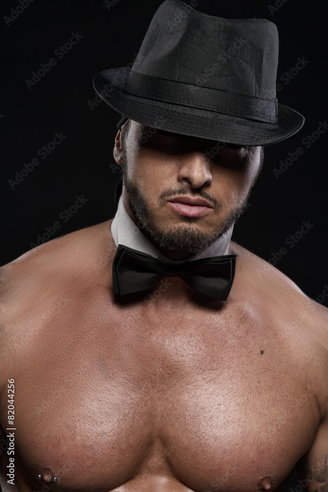 Attractive shirtless young man with black bowtie and top hat Stock ...