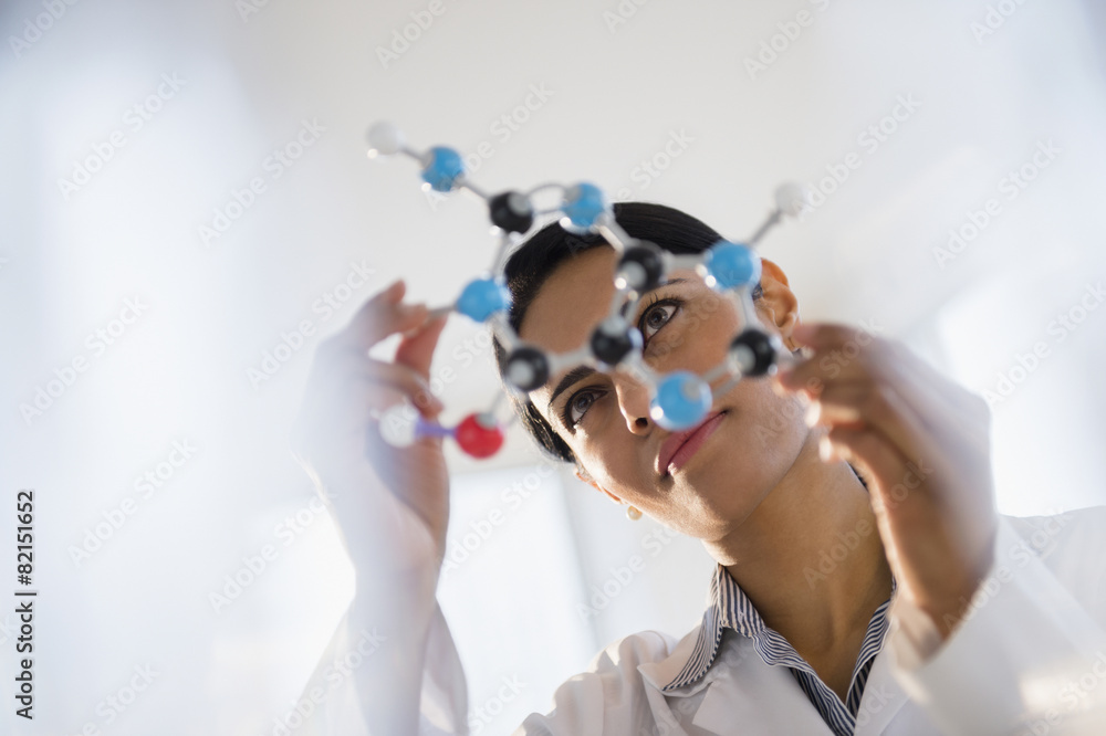 Indian scientist examining molecular model in lab Stock Photo | Adobe Stock