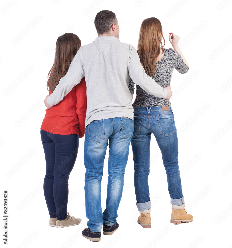 Back view of three friends (woman and man). Stock 写真 | Adobe Stock
