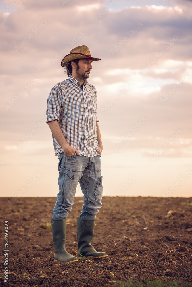 Male Farmer Standing on Fertile Agricultural Farm Land Soil Stock Photo ...