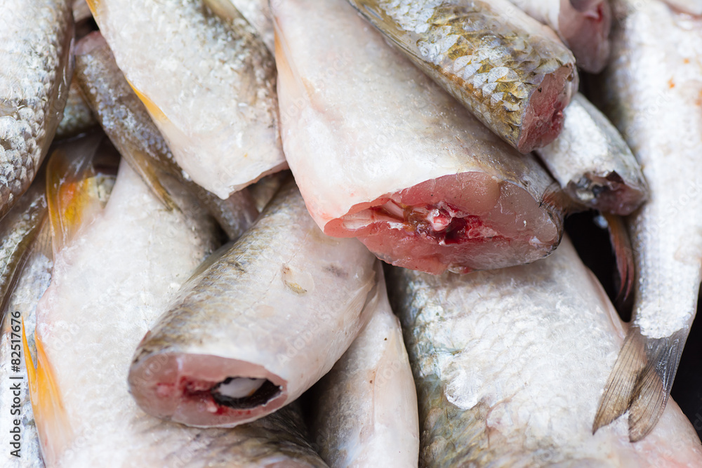 Cutted head fish for cooking. Stock Photo | Adobe Stock