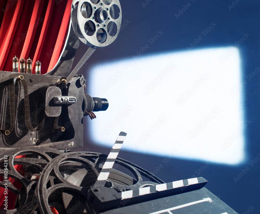 Film projector projecting a movie on the wall Stock Photo | Adobe Stock