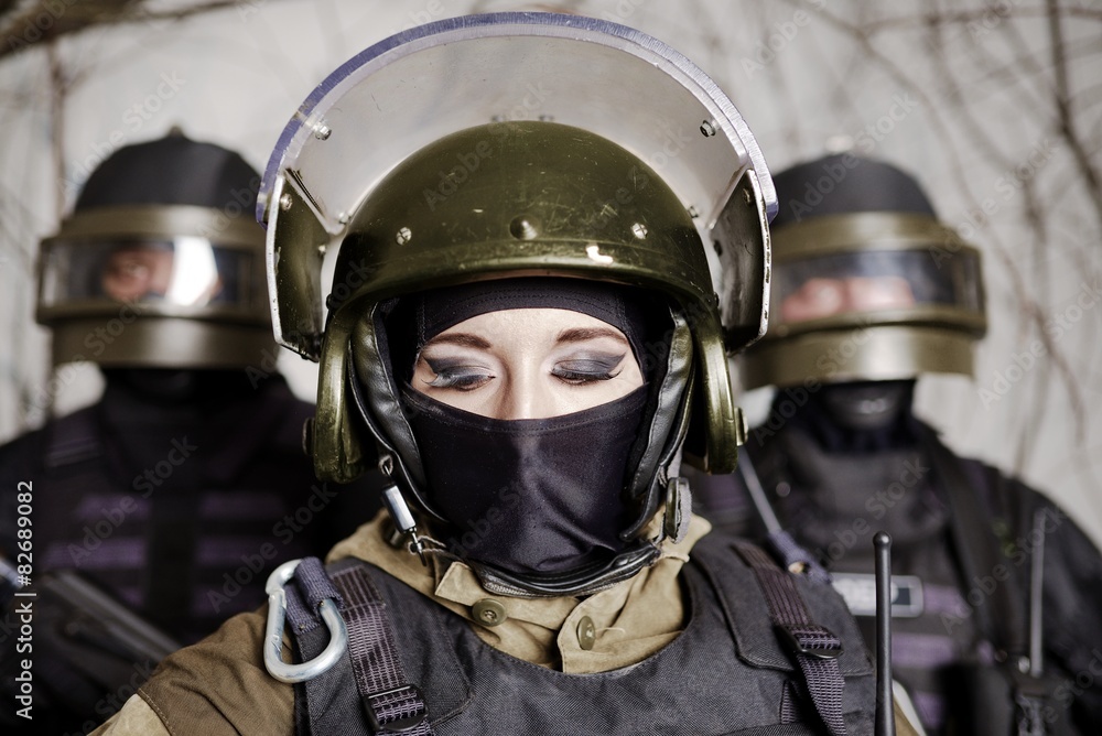 The beautiful young girl in a military uniform and a helmet Stock Photo ...