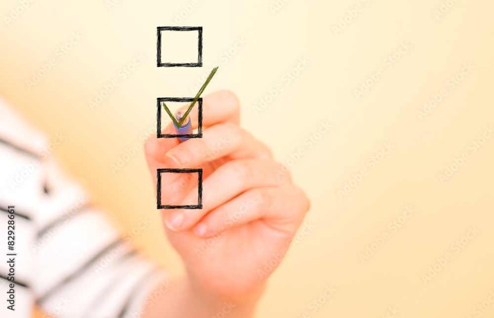 Hand putting check mark with pen Stock Photo | Adobe Stock