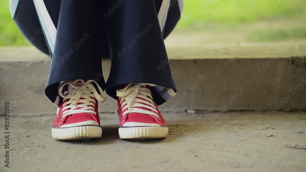 Young Woman Tapping Feet and Waiting Stock Video | Adobe Stock