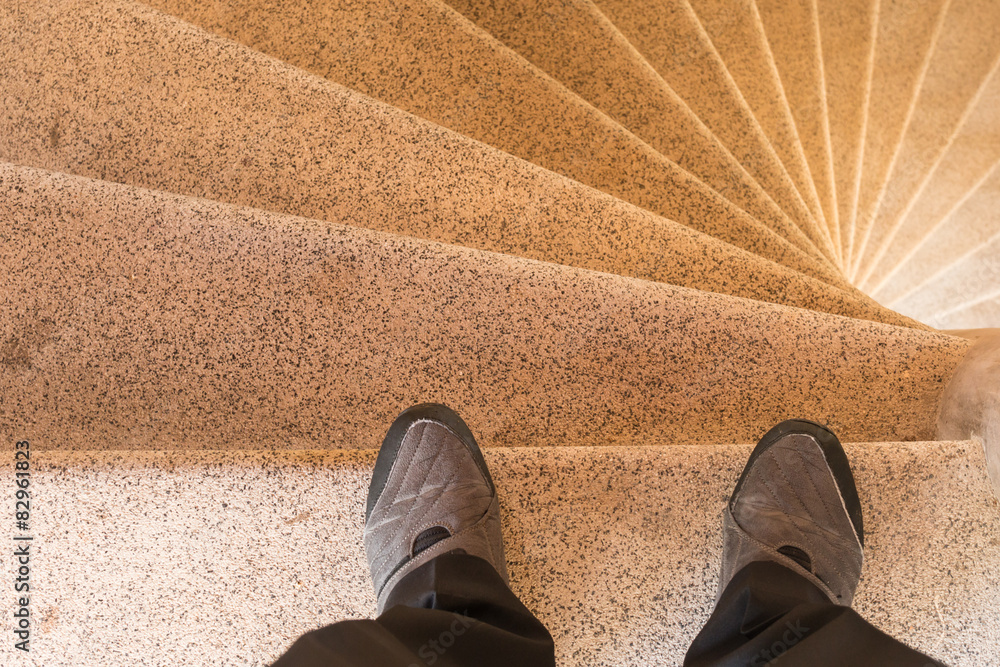 Feet of a man who was standing on the circular staircase Stock Photo ...