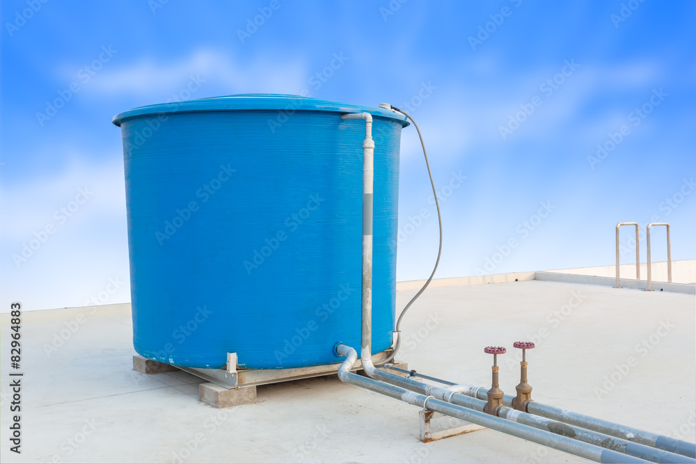 Blue water tank of industrial building on roof top and blue clou Stock ...