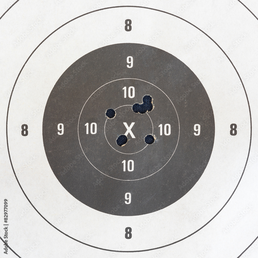 Close up of a shooting target and bullseye with bullet holes. Stock 写真 | Adobe Stock