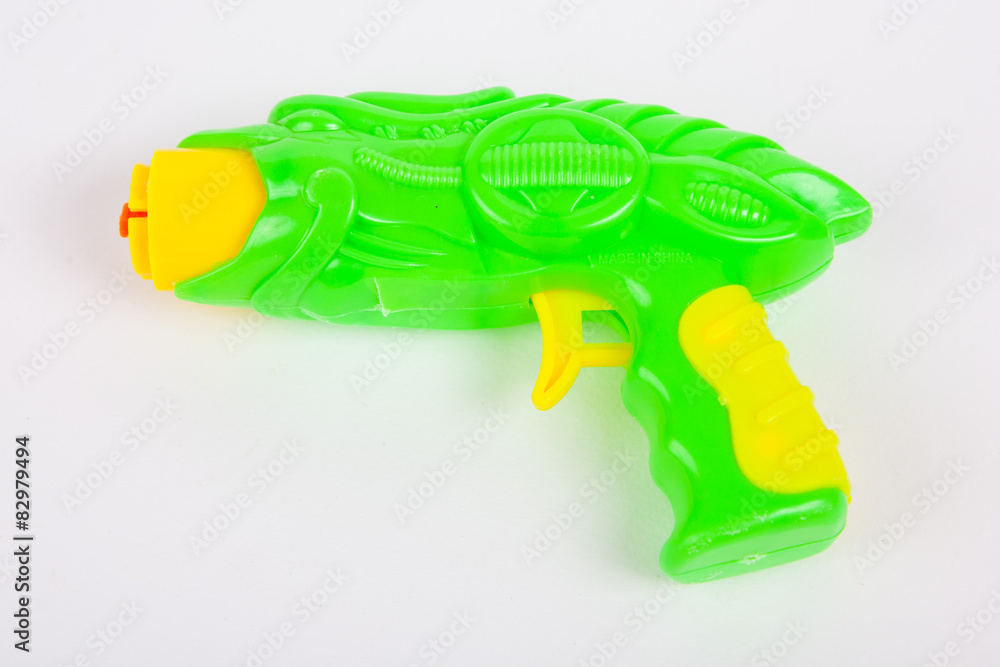 toy gun on white paper background Stock Photo | Adobe Stock