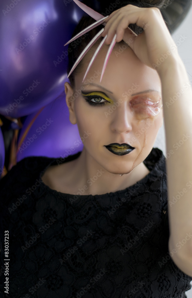 Beautiful one-eyed brunette with long nails crying Stock Photo | Adobe ...