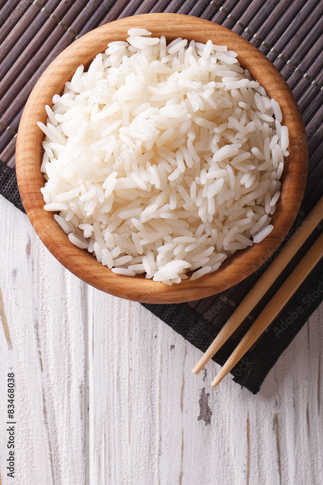 rice in a wooden bowl and chopsticks vertical top view Stock Photo ...
