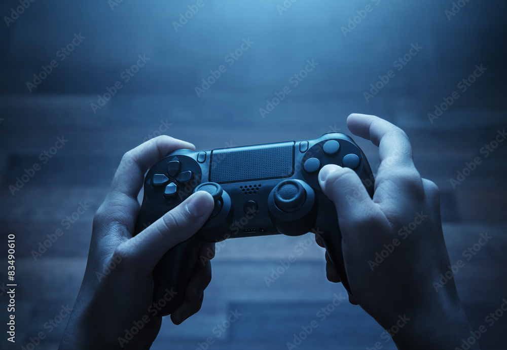 Playing the video game late at night Stock-Foto | Adobe Stock