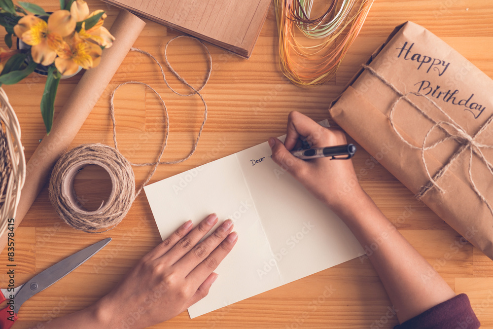 Signing birthday card Stock Photo | Adobe Stock