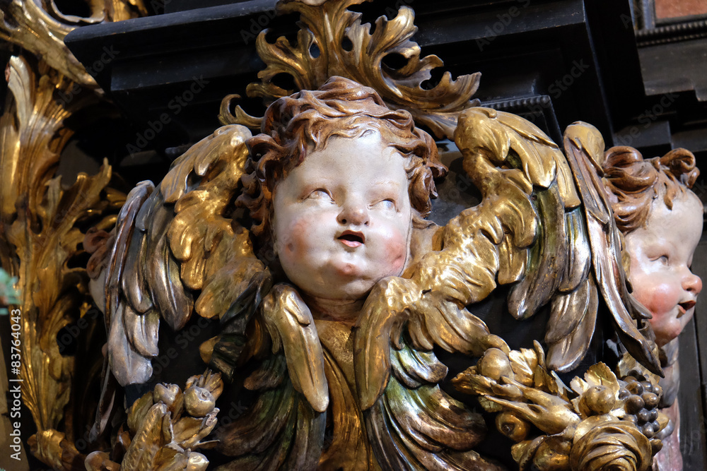 Angel on the altar of the Holy Rosary in Parish church in St. Wolfgang ...