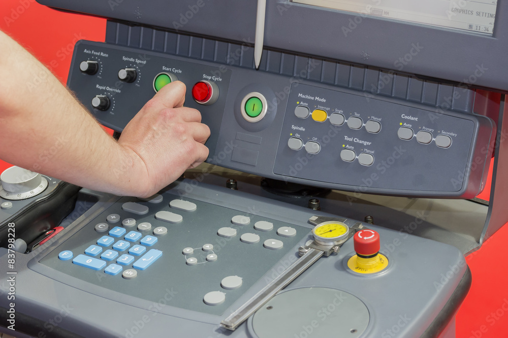 Hand using control panel of a cnc machine Stock Photo | Adobe Stock