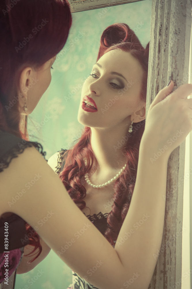 Pin-up girl kissing a mirror Stock Photo | Adobe Stock