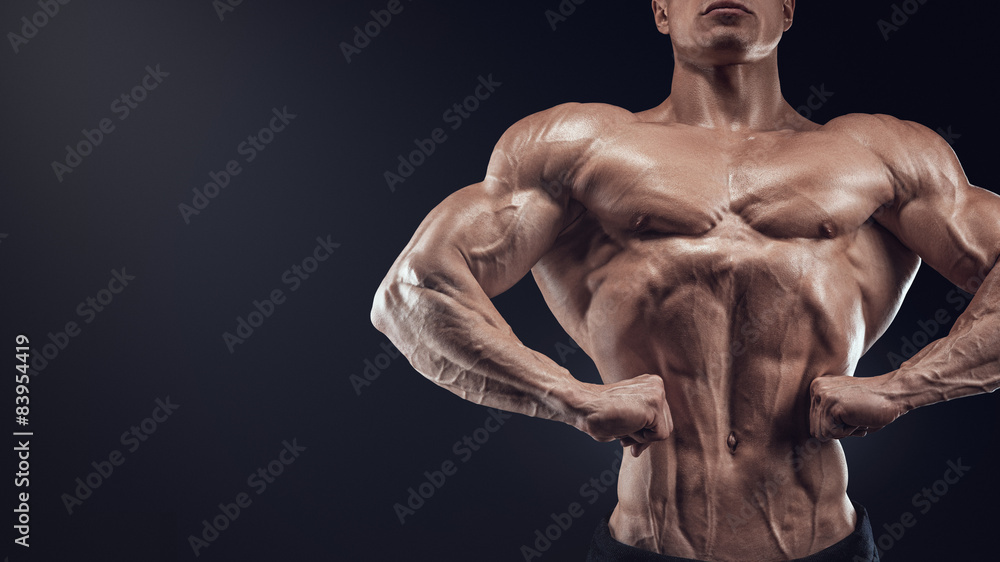 Handsome muscular bodybuilder posing on Front Lat Spread Stock Photo ...