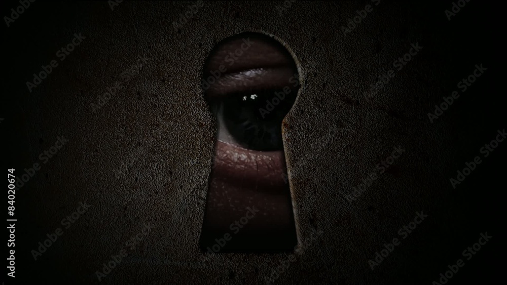 Eyes watching through a keyhole. Watch through the dark keyhole Stock ...