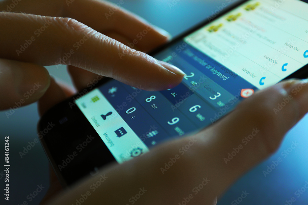 Finger touch number on smartphone to make a call, close up Stock Photo ...