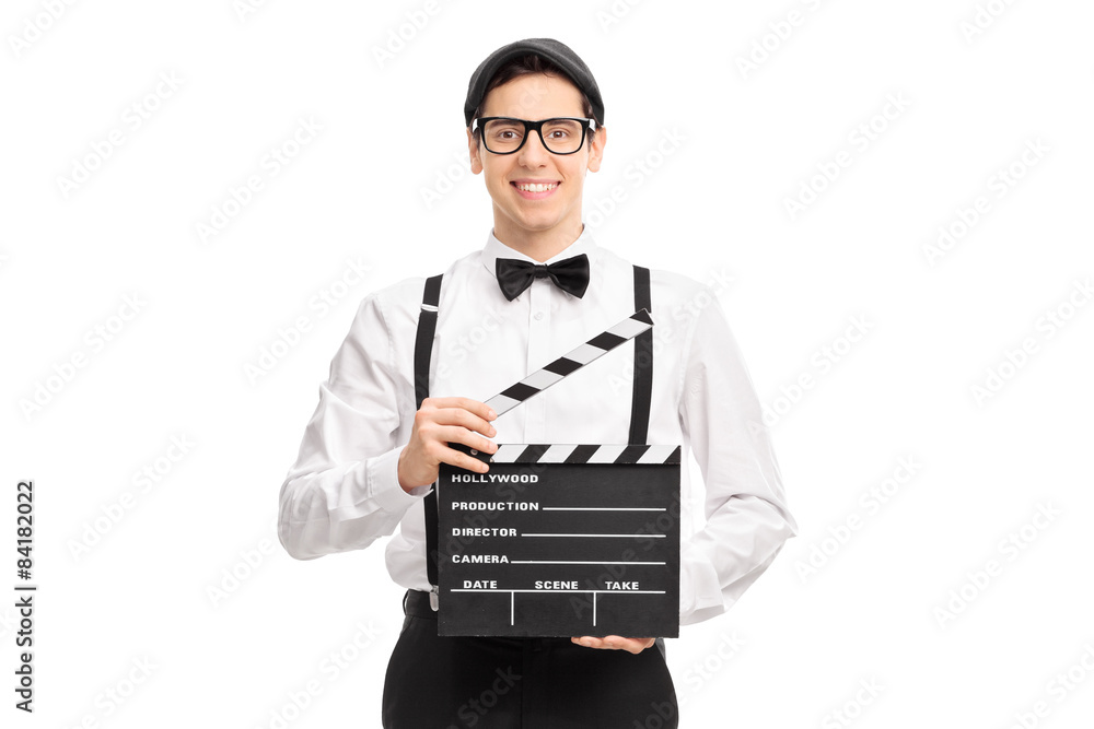 Young movie director holding a movie clapperboard, smiling and l Stock ...