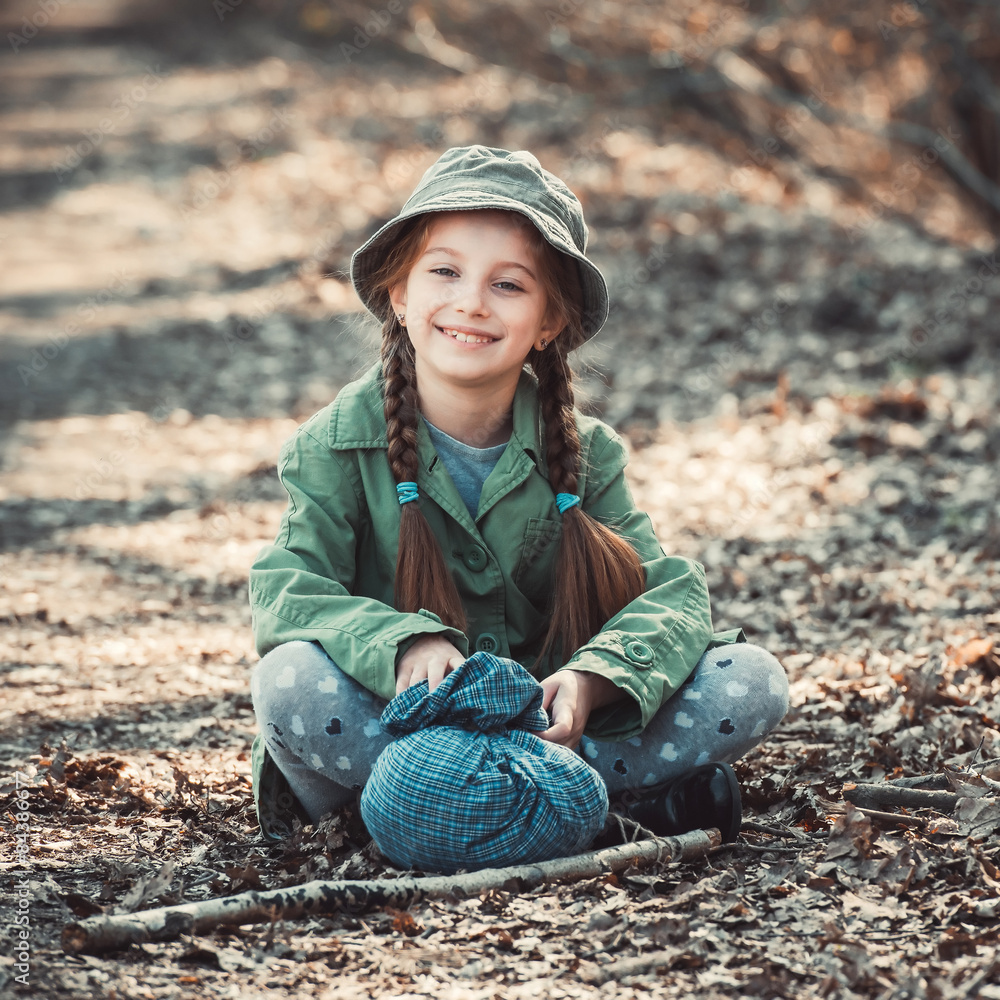 little girl playing in the woods, Stock Photo | Adobe Stock