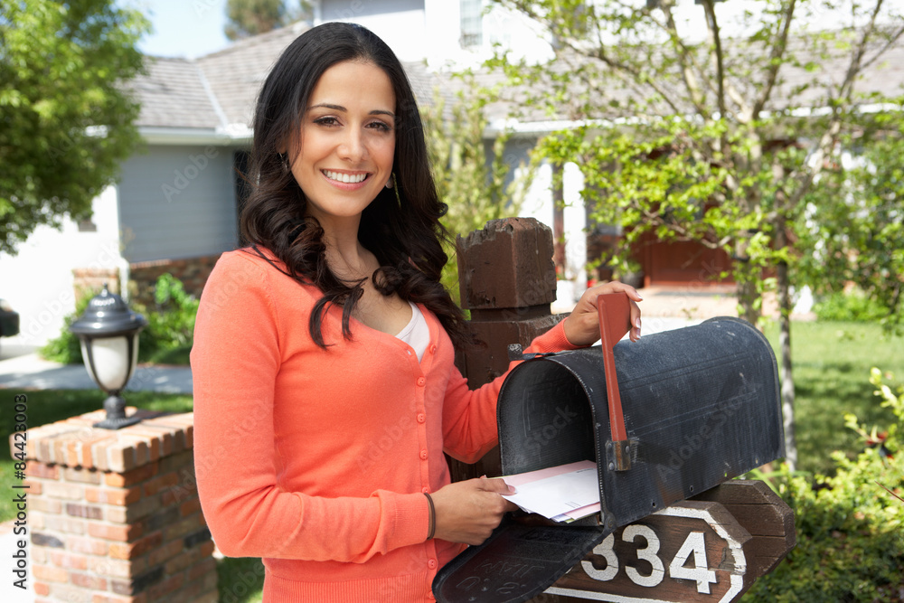 Hispanic Woman Checking Mailbox Stock Photo | Adobe Stock