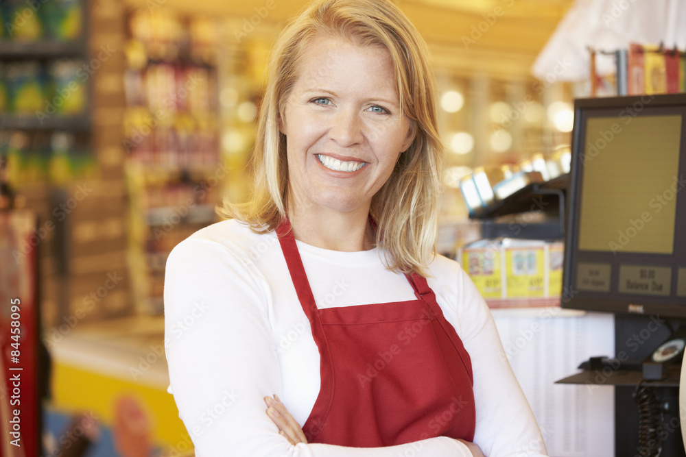Female Cashier At Supermarket Checkout Stock Photo | Adobe Stock