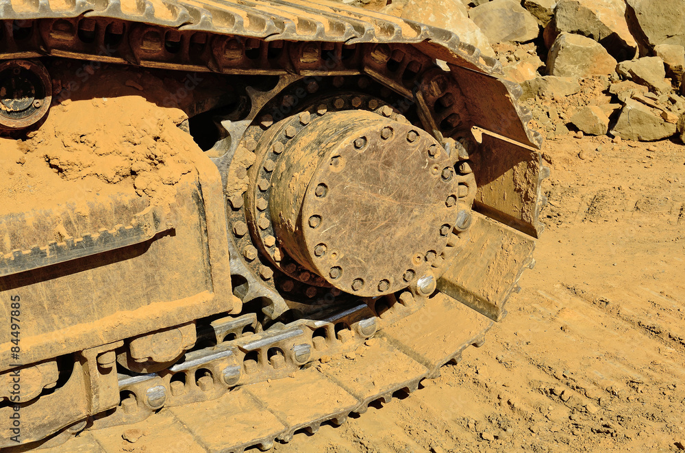 Detail of a large track hoe excavator working a new commercial ...