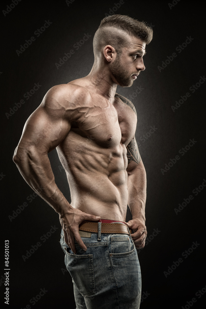 Muscular man - side view - on black background Stock Photo | Adobe Stock