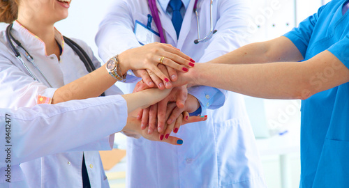 Doctors and nurses in a medical team stacking hands #83852661 - Wzory ...