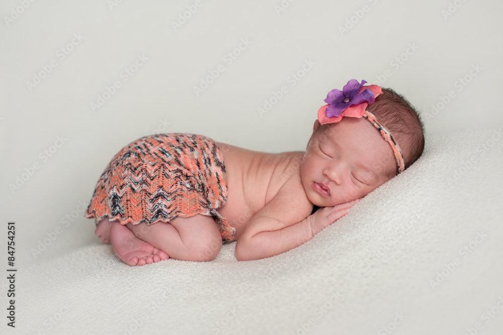 Newborn Baby Girl Wearing an Orange Mini Skirt Stock Photo | Adobe Stock