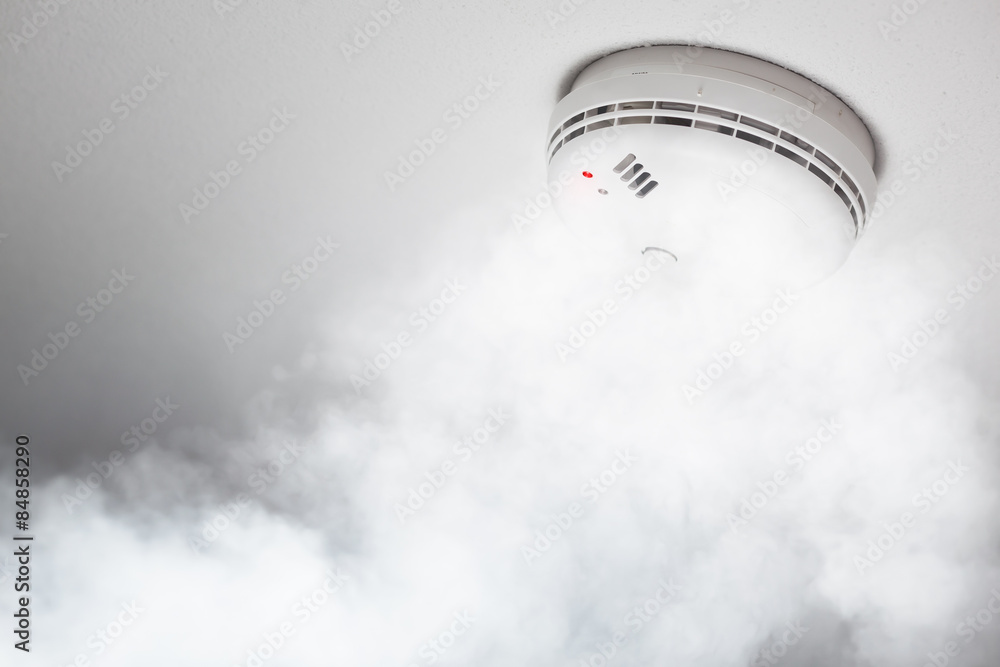 smoke detector of fire alarm in action, white background Stock Photo ...