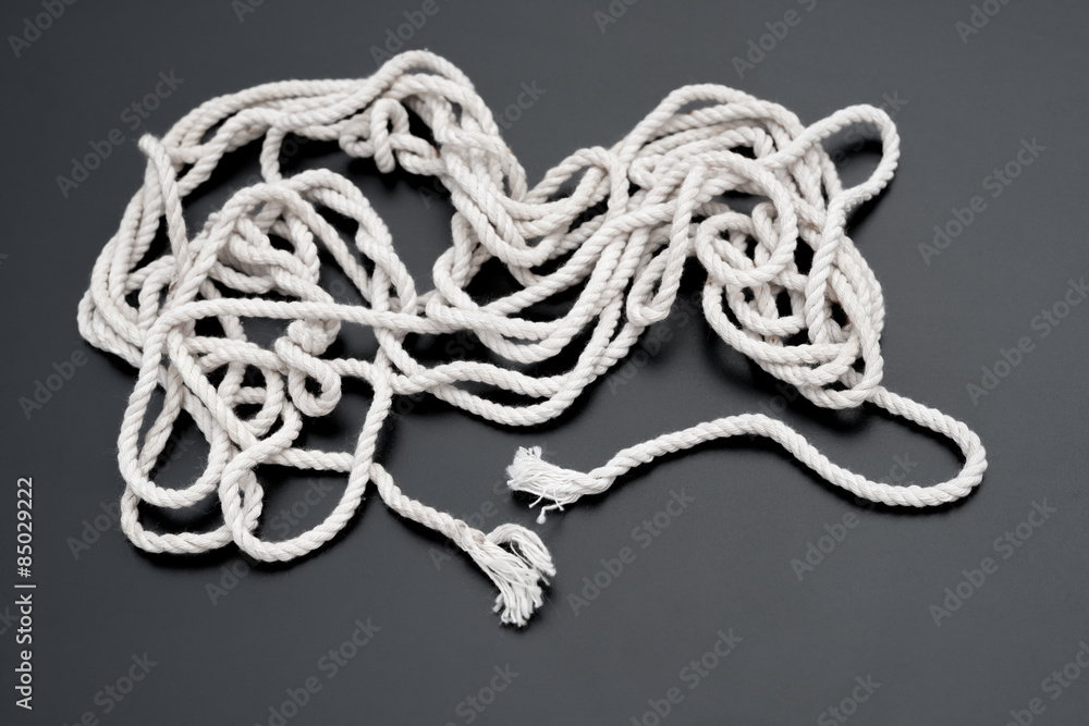 white rope on a black background Stock Photo | Adobe Stock