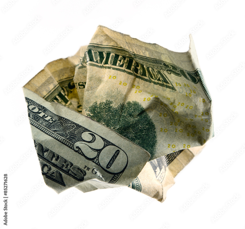 Crumpled $20 dollar bill isolated on white. Stock Photo | Adobe Stock