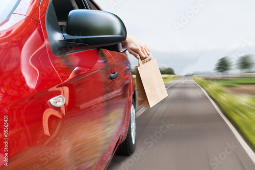 Person Throwing Trash Out Of Car Window Stock Photo | Adobe Stock