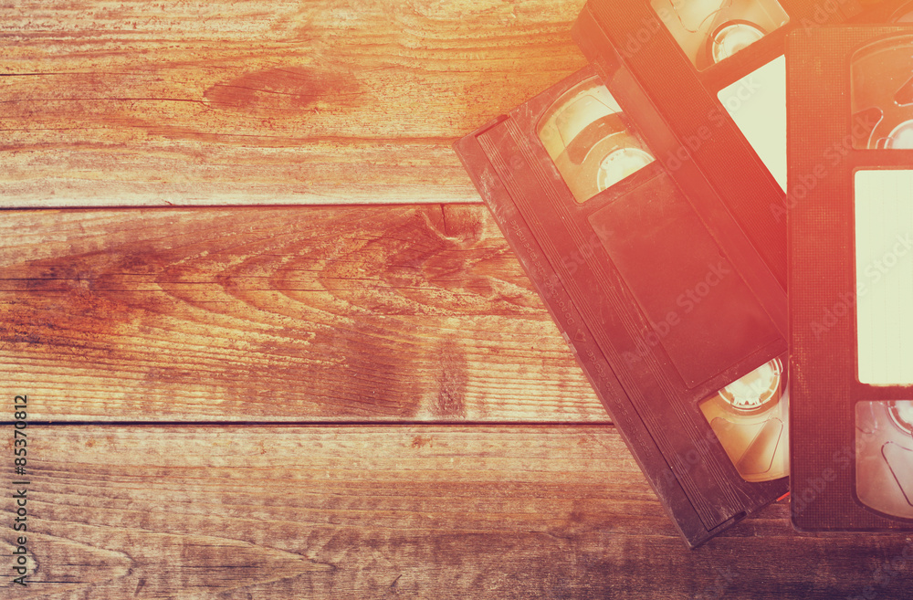 stack of VHS video tape cassette over wooden background ภาพถ่ายสต็อก ...