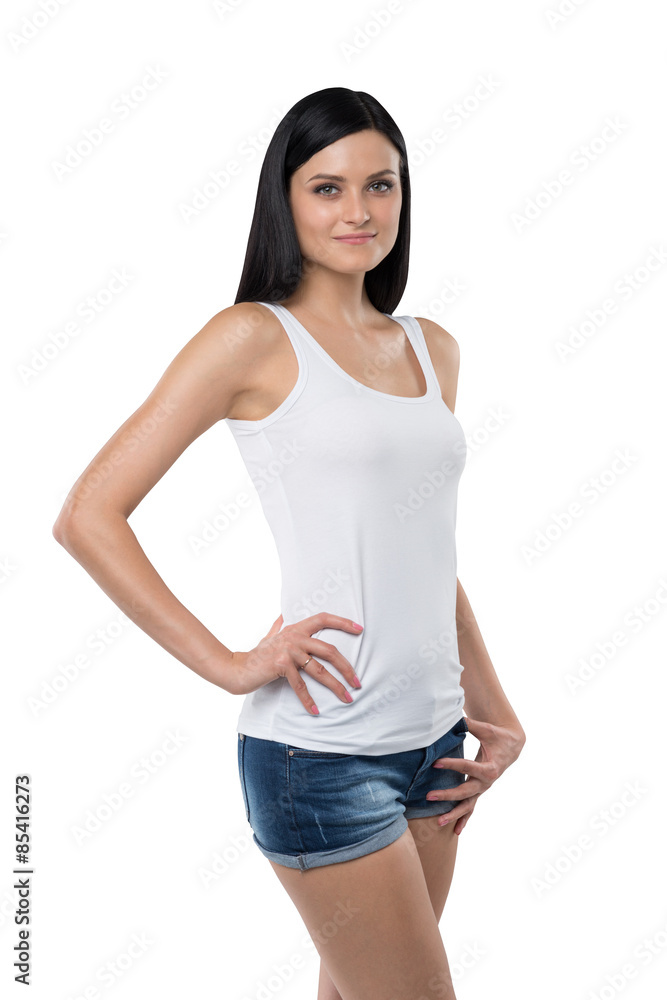 Close-up of a brunette woman holding a hand on the waist. Isolated ...