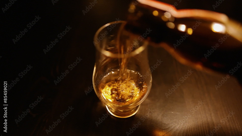 Pouring a glass of single malt Scotch whisky from a bottle (hd, 1080p ...