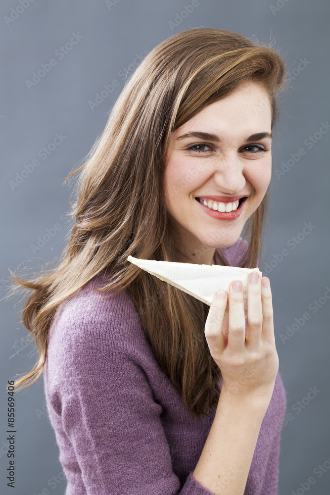 happy gorgeous young woman with cheese portion in hand for dairy diet ...