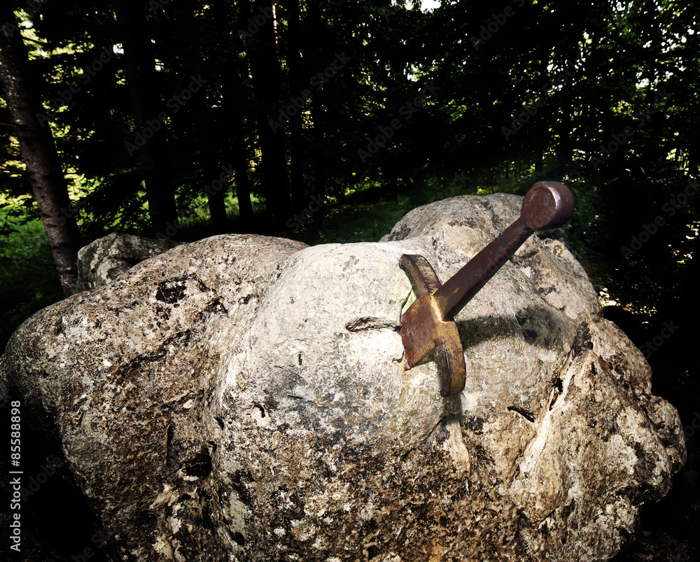 excalibur the famous sword in the stone of king Arthur in the fo Stock ...