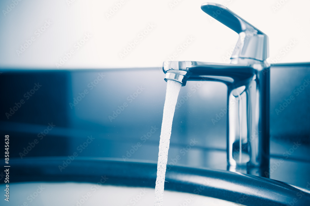 faucet with flowing water, blue tone Stock Photo | Adobe Stock