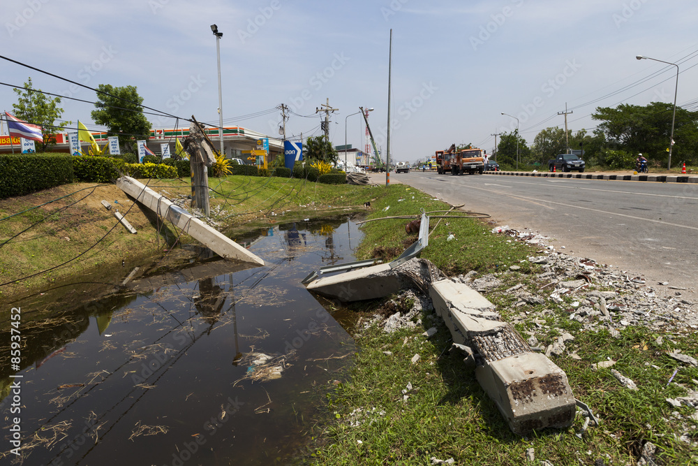 High voltage electricity post damage besides highway due to heavy rain ...