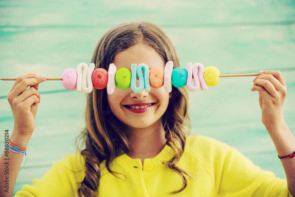 Happy girl with sweets Stock Photo | Adobe Stock