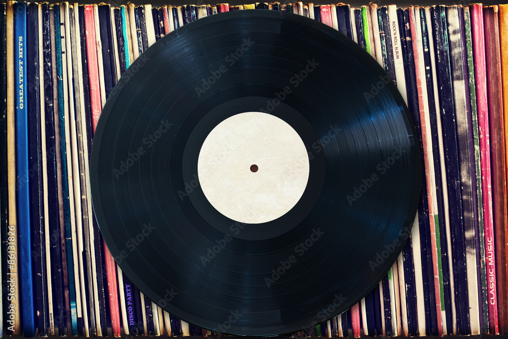Vinyl record with copy space in front of a collection of albums (dummy ...