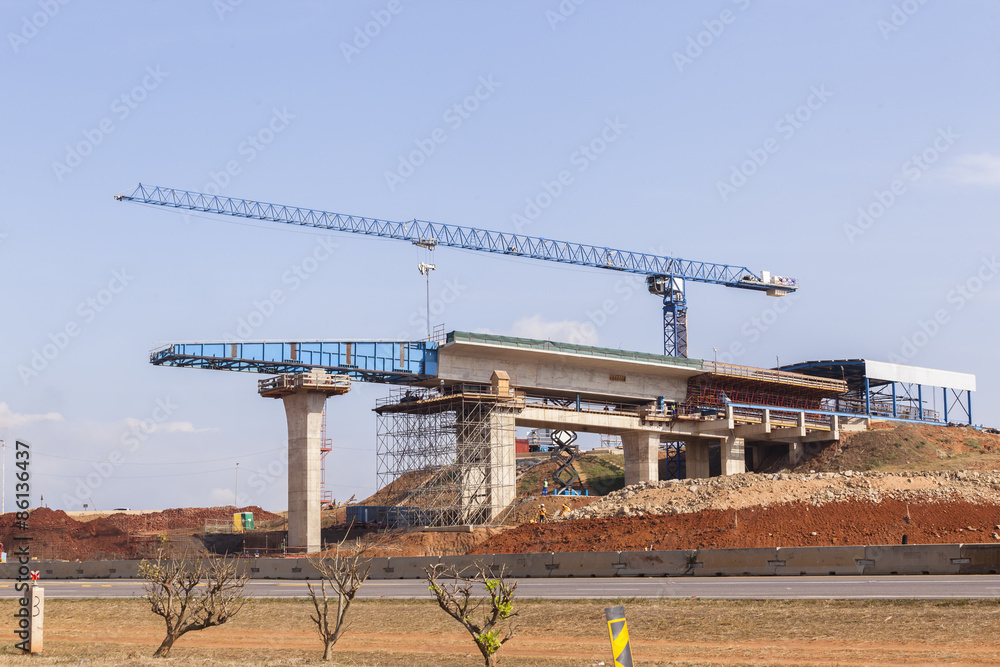Highway Construction crane concrete road sections on new flyover entry ...