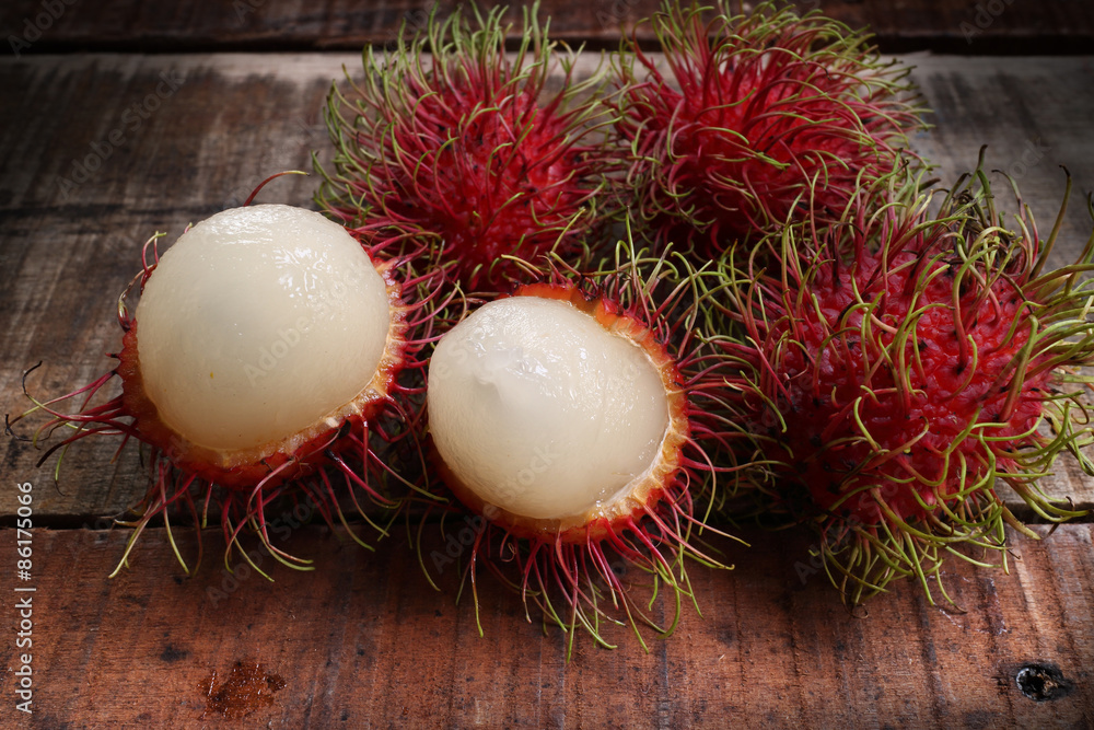 Red rambutan Nephelium lappaceum on broun board. Fruit tropical tree of ...