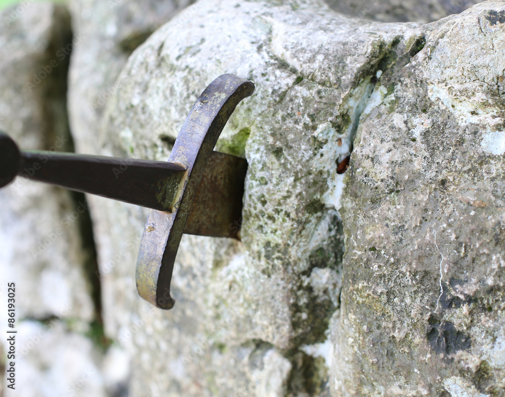 excalibur the famous sword in the stone of king Arthur in the fo Stock ...