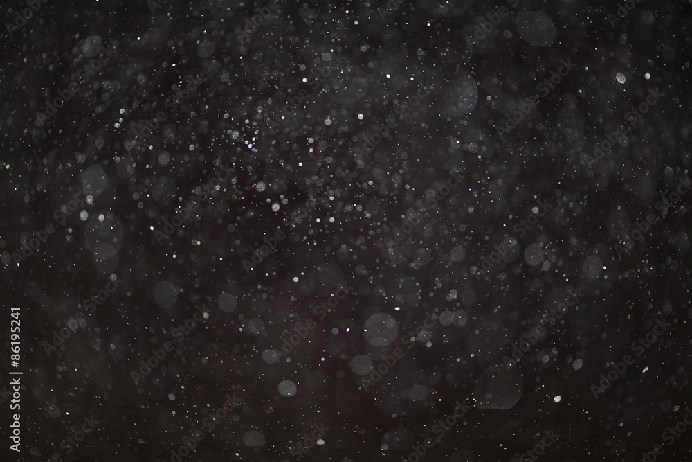 texture of white rain drops on a black background for a filter on the ...